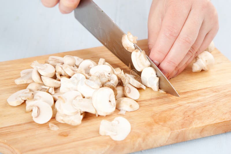 Cutting the mushrooms stock image. Image of hands, vegetables - 46868567