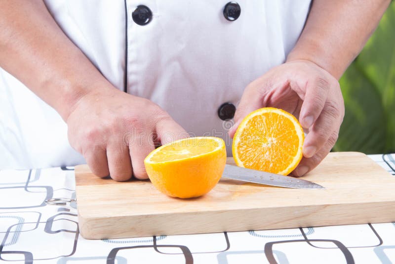 Cutting orange stock image. Image of hand, chopped, food - 72970285