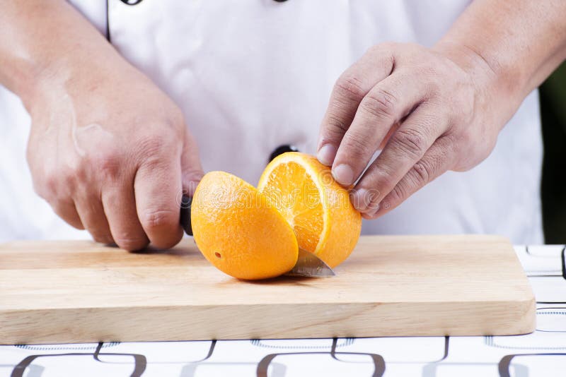 Cutting orange stock image. Image of closeup, person - 64436817
