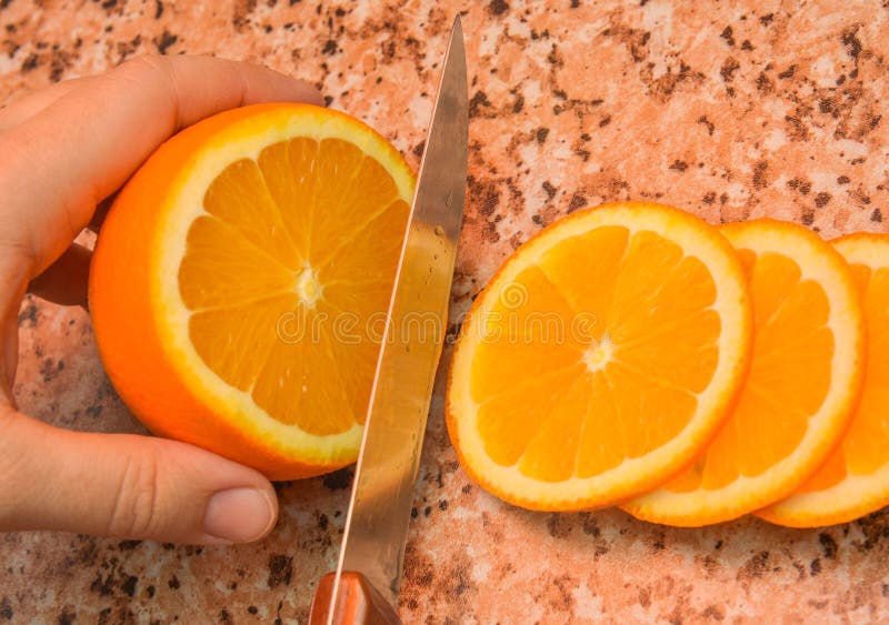 Cutting An Orange To Make Fresh And Healthy Orange Juice. Healthy ...