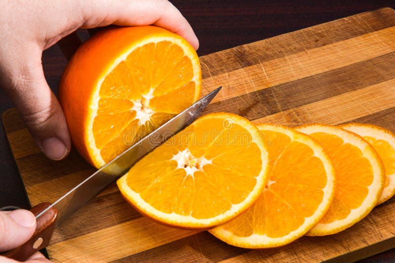 Cutting by orange stock photo. Image of juicy, apfelsine - 63548146
