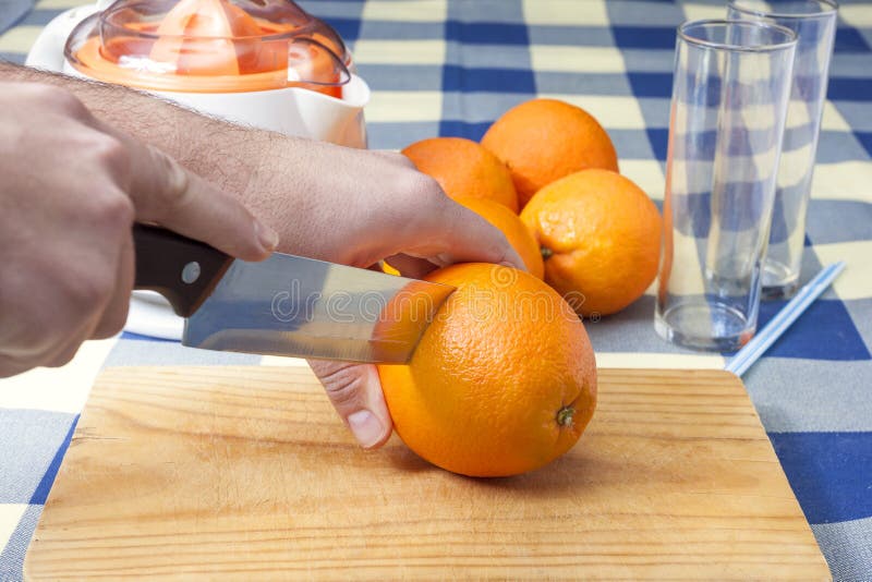 Cutting oranges stock photo. Image of hand, closeup, freshness - 48336198