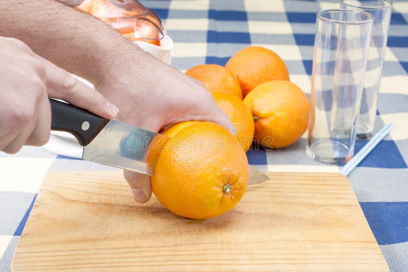 Cutting oranges stock photo. Image of hand, closeup, freshness - 48336198