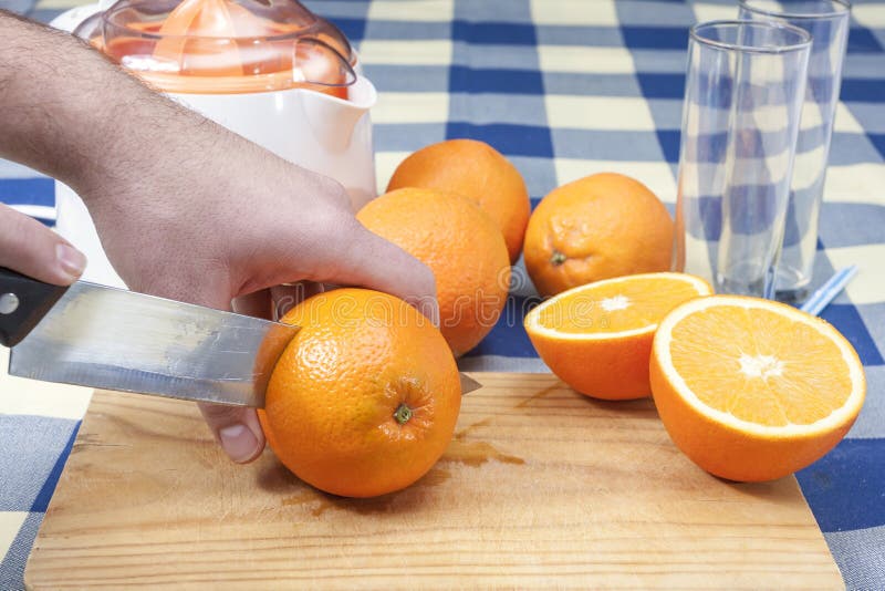 Cutting oranges stock photo. Image of hand, closeup, freshness - 48336198