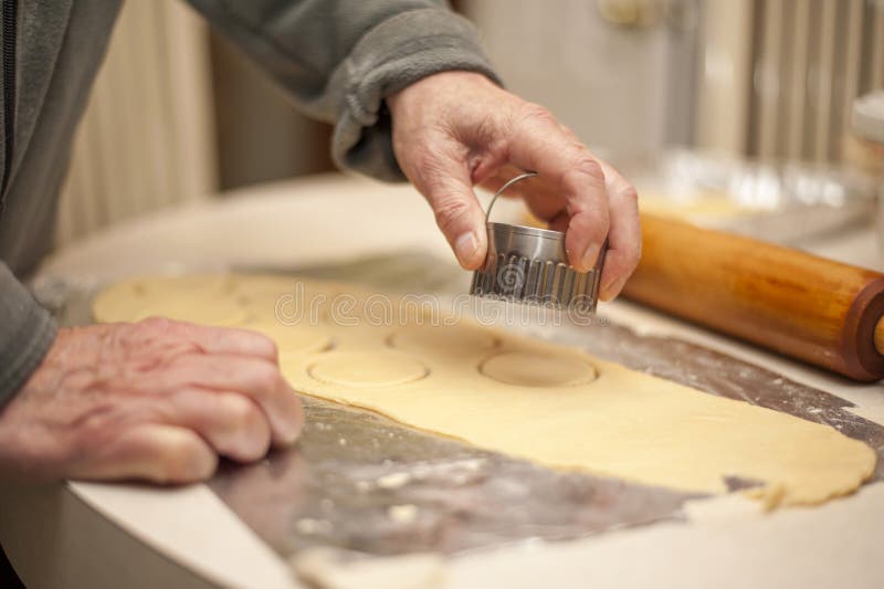Baker Prepares Dough Cut Outs with Cookie Cutter Stock Photo - Image of ...