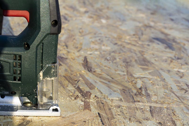 Cutting Out an OSB Sheet with a Jigsaw. Stock Image - Image of ...