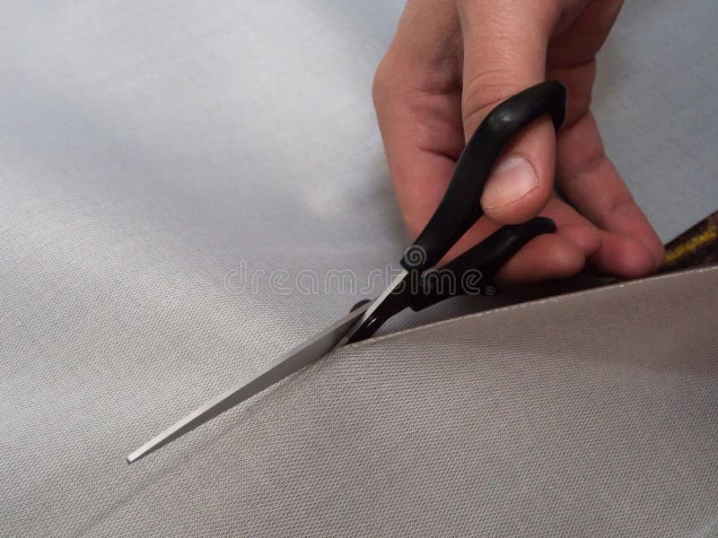 Cutting Out of Textile with Scissors. Closeup Stock Photo - Image of ...
