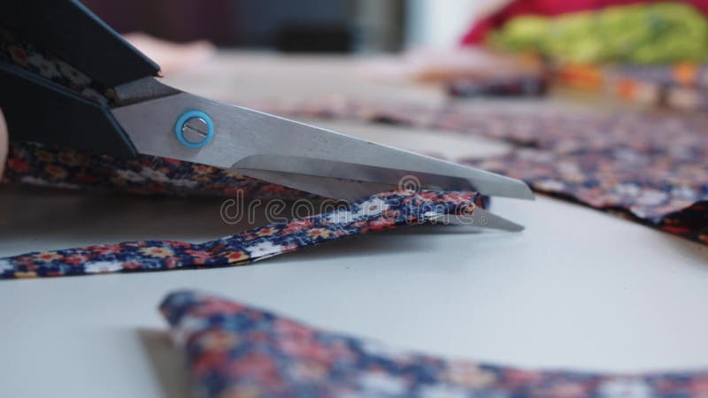 Cutting the Patterns Out of Fabric Using Scissors Stock Video - Video ...