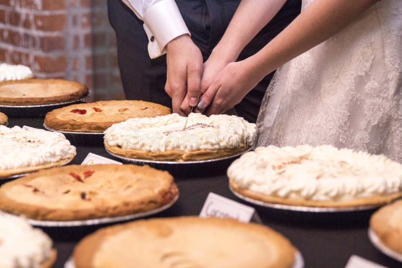 Cutting pies celebration stock photo. Image of crust - 140618836