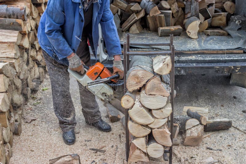 Cutting Wood with a Chainsaw Stock Photo - Image of strenuous, gear ...