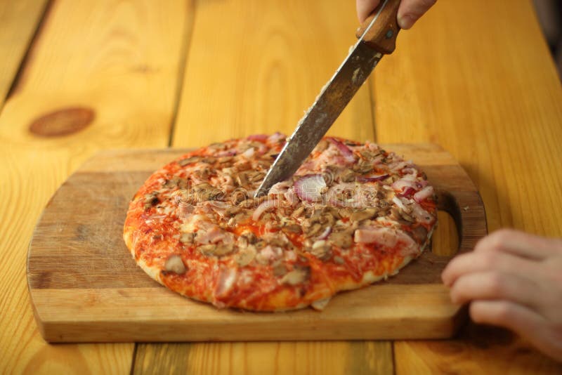 Cutting Pizza on the Bottom with a Knife Stock Image - Image of pizza ...