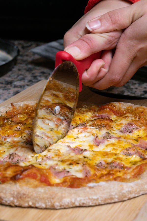 Cutting pizza stock image. Image of melted, delicious - 345562665