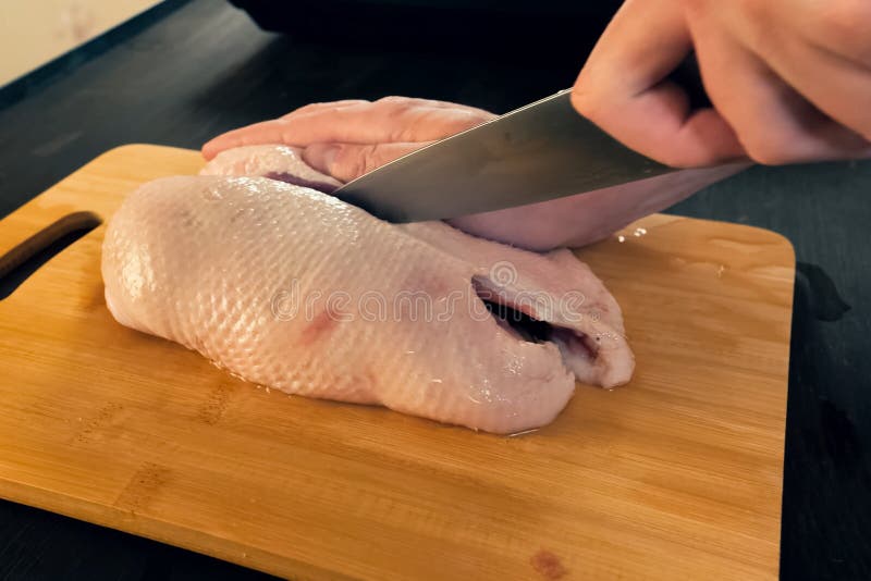 Cutting Poultry Meat. Broiler Breast, Chicken Meat on Cutting Board ...