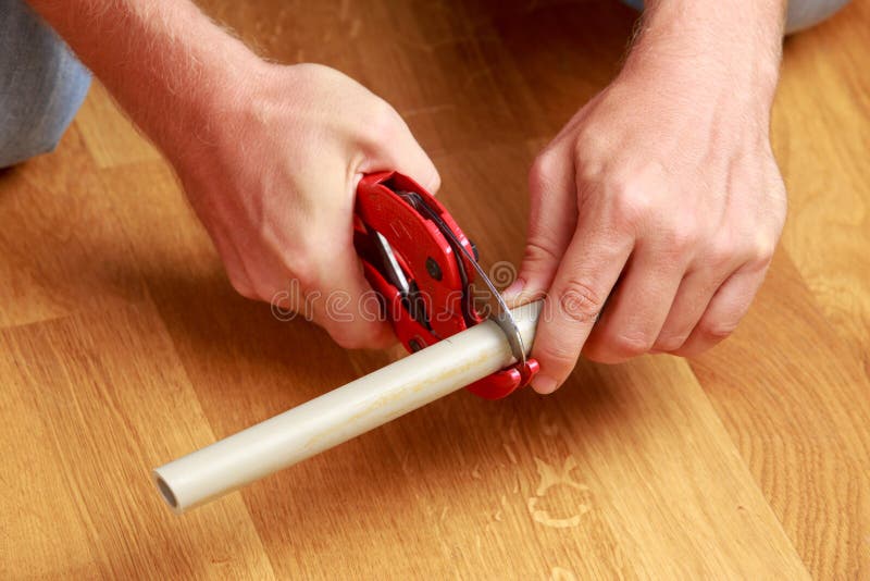 Cutting pvc pipe stock photo. Image of construction - 162720970