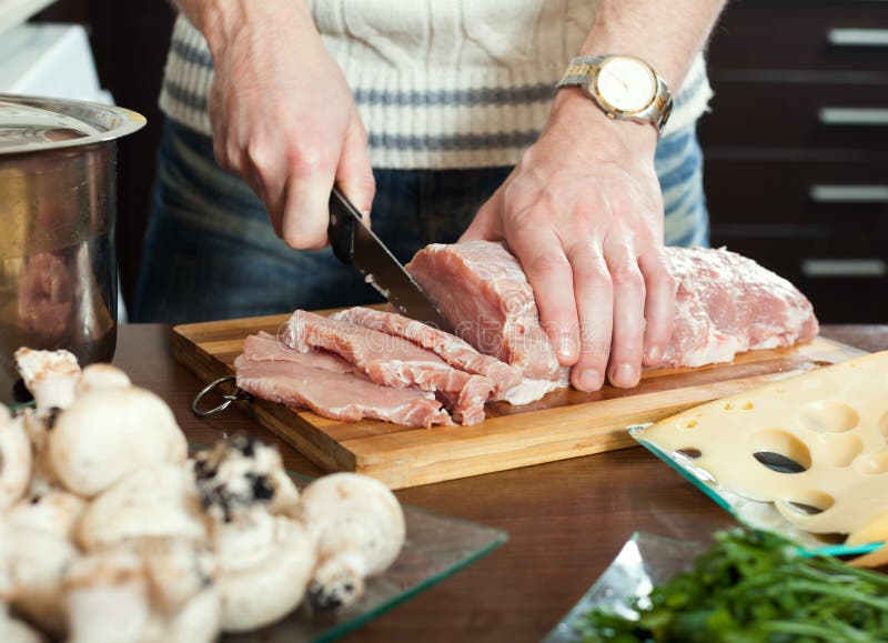 Cutting raw meat stock photo. Image of escalope, hands - 36288310