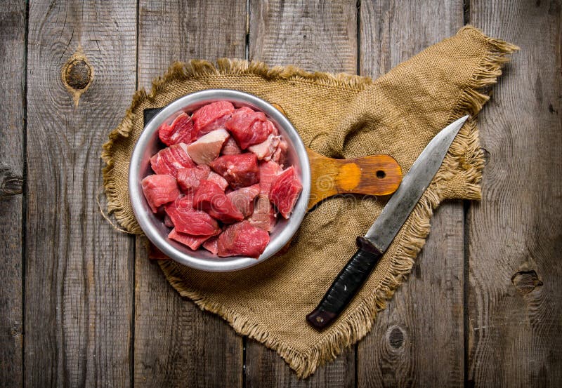 Cutting Raw Meat a Large Knife. on Wooden Table. Stock Photo - Image of ...