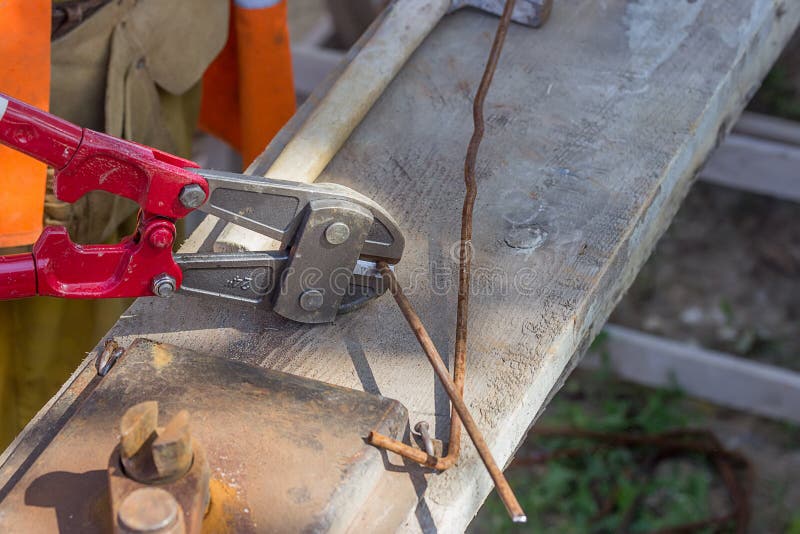 Cutting Rebar with Bolt Cutters Stock Photo - Image of laborer, person ...