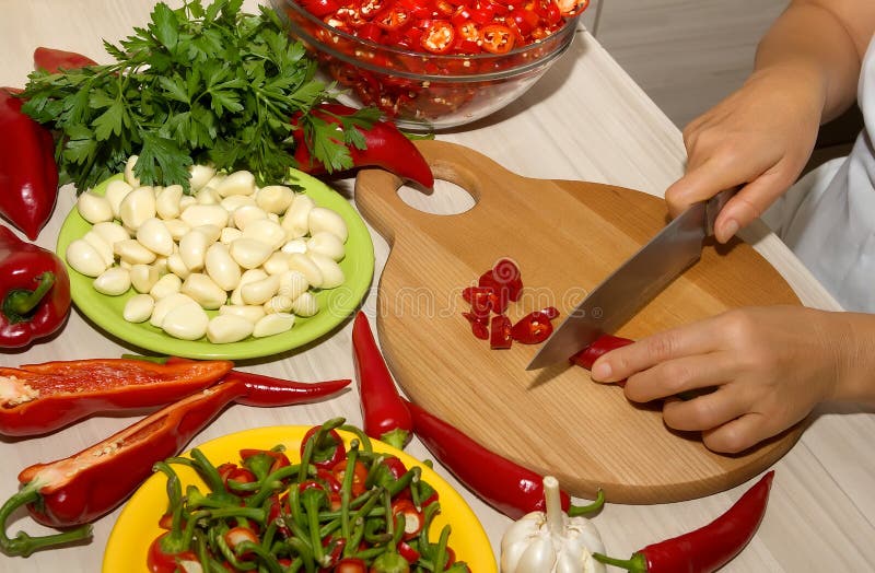 Cutting red chili pepper stock photo. Image of eating - 46557008
