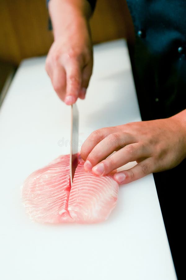 Cutting red fish knife stock photo. Image of board, kitchen - 15396022