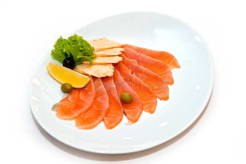 Cutting Red Fish with an Orange Slice in Greens and Olives Stock Photo ...