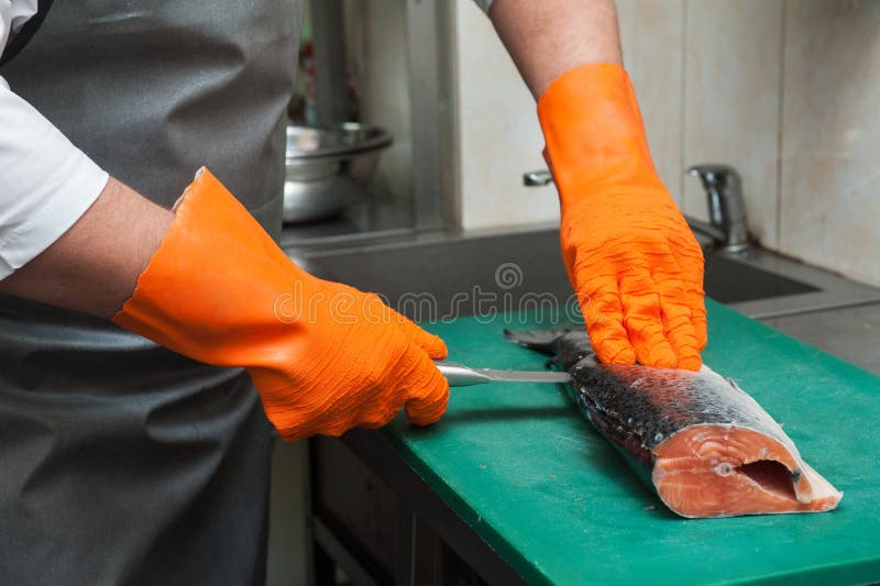 Cutting salmon fish stock photo. Image of hands, hand - 89144986
