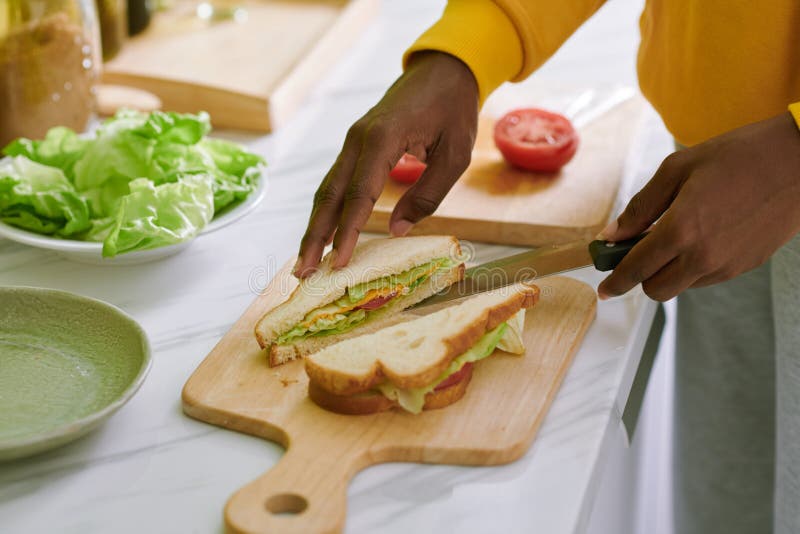 Cutting Sandwich in Two Triangles Stock Image - Image of salad ...