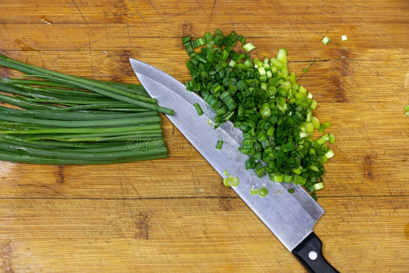 Scallions with Chef Knife on Wooden Cutting Board Stock Image - Image ...
