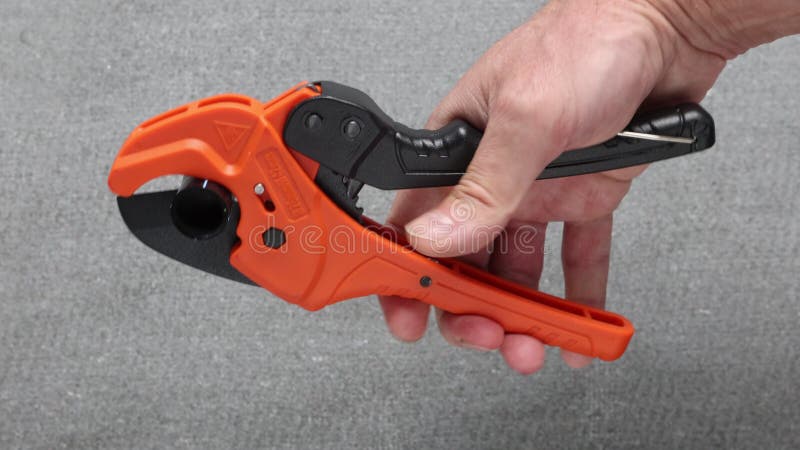 Cutting Section of Water Pipe with Plastic Pipe Cutter. Stock Video ...