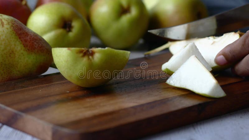 Cutting Slice of Fresh Pears with a Knife on Table Close Up Stock Video ...