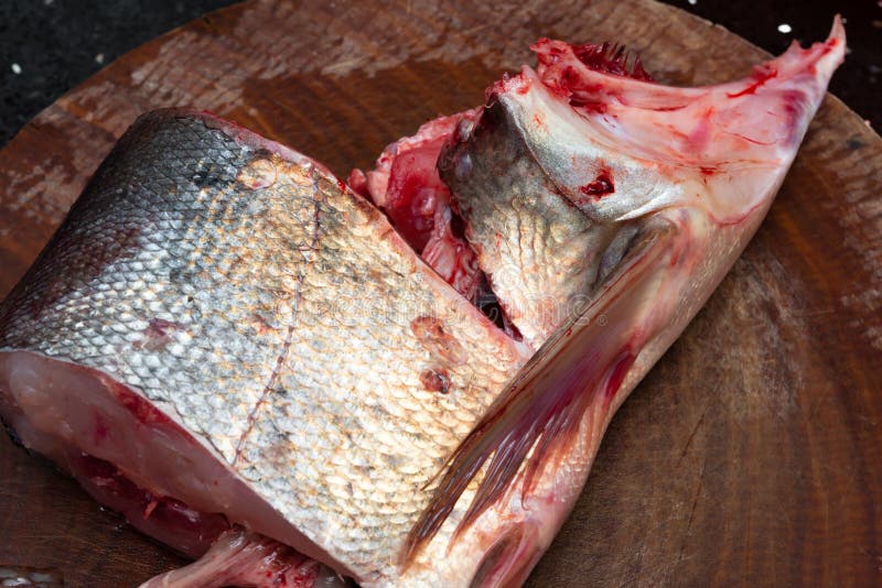 Cutting slice of raw fish stock photo. Image of ingredient - 128048704