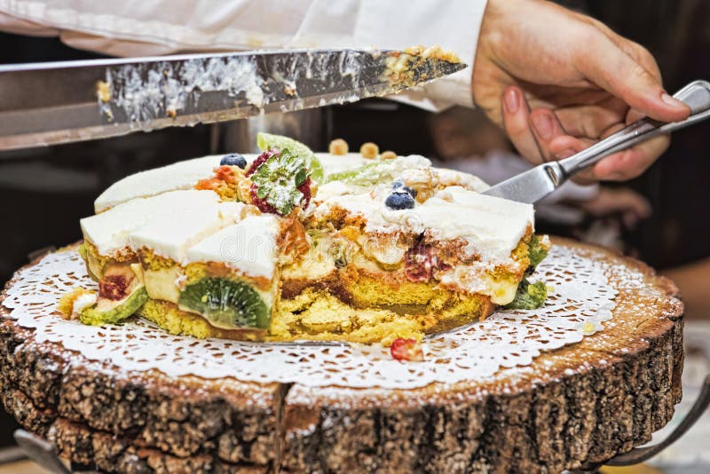 Cutting a Soft Sponge Cake with Cream and Fresh Fruit Stock Image ...