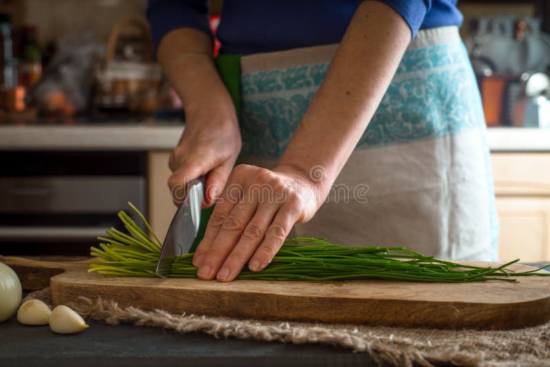 Cutting Spring Onion on the Wooden Board Horizontal Stock Image - Image ...