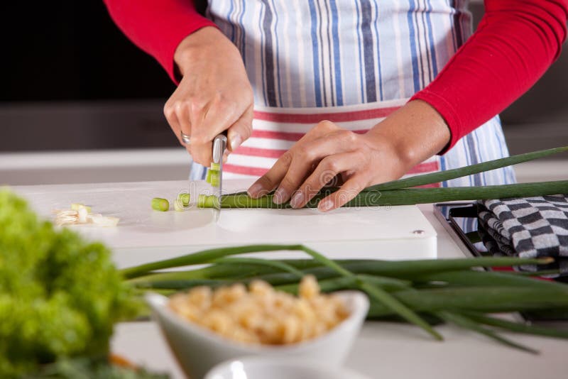 Cutting the spring onions stock photo. Image of cutting - 16255858