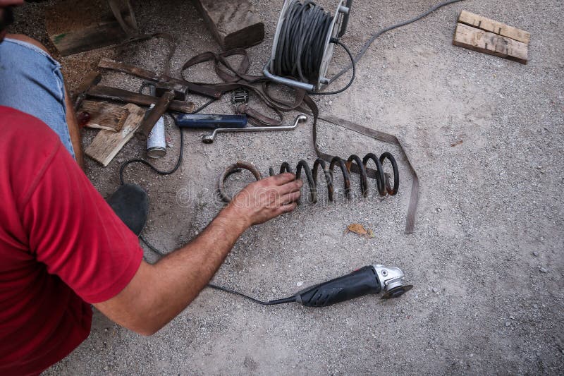 Cutting springs on a car stock image. Image of garage - 187806611