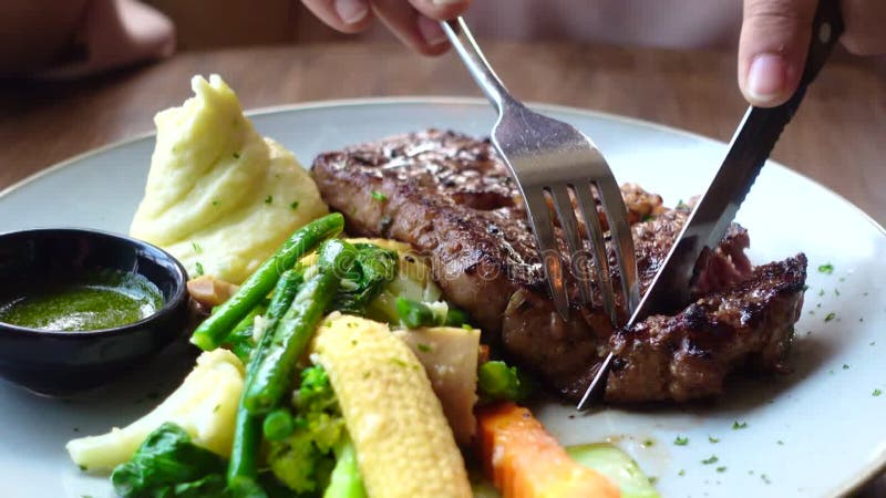 Cutting a Steak with a Knife Stock Footage - Video of smoke, grill ...