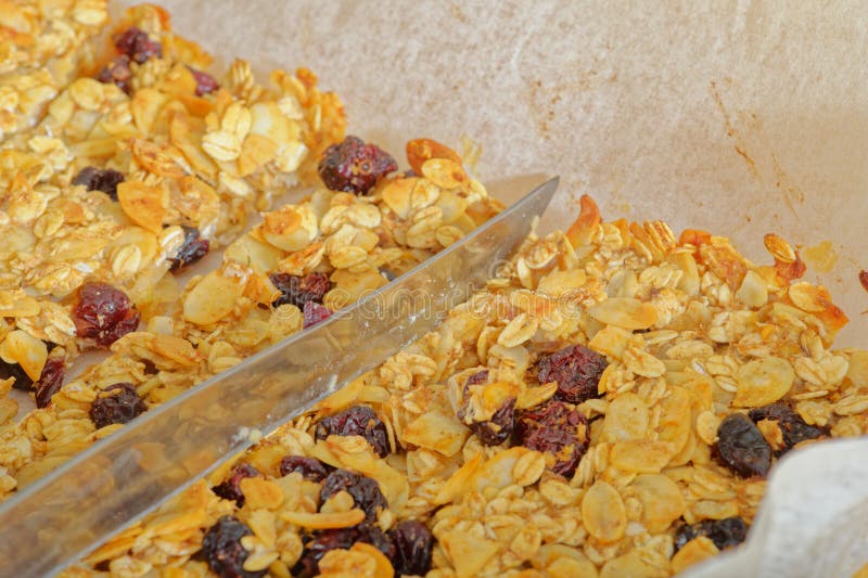 Cutting oatmeal bar stock photo. Image of sharp, fruit - 303745820