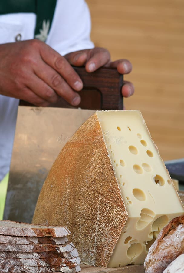 Cutting a Swiss Cheese Loaf Stock Image - Image of close, shallow: 53762069