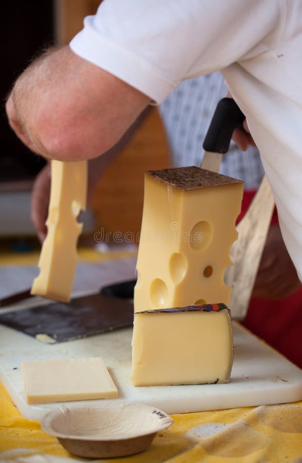 Cutting swiss hard cheese stock photo. Image of white - 95919000