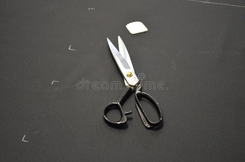 Cutting Table, Lined Fabric and Scissors Stock Image - Image of ...