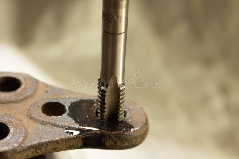 Cutting a Thread in a Hole with a Tap by Hand. Material High Speed ...