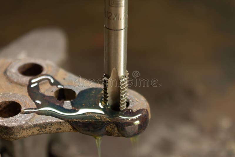 Cutting a Thread in a Hole with a Tap by Hand. Material High Speed ...