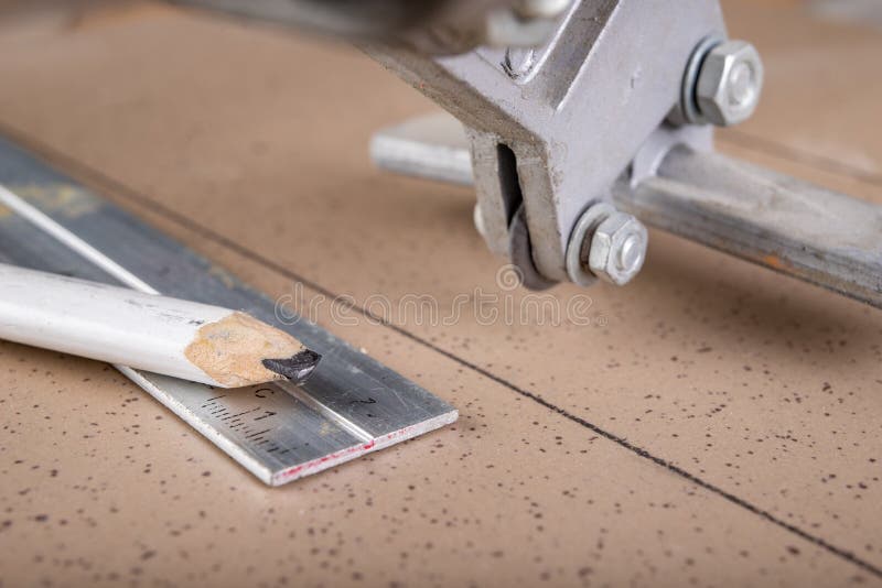 Cutting Tiles in a Home Workshop. Tiling Work on a Workshop Table Stock ...