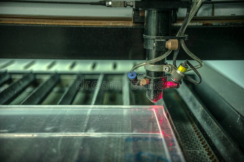 Cutting of Transparent Plastic on a Production Laser Machine. Red Laser ...