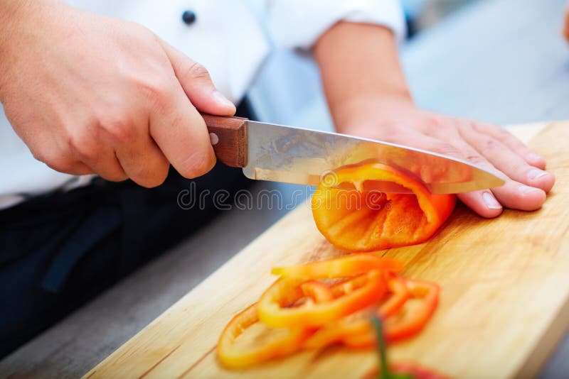 Cutting vegetables stock photo. Image of indoors, knife - 67579272