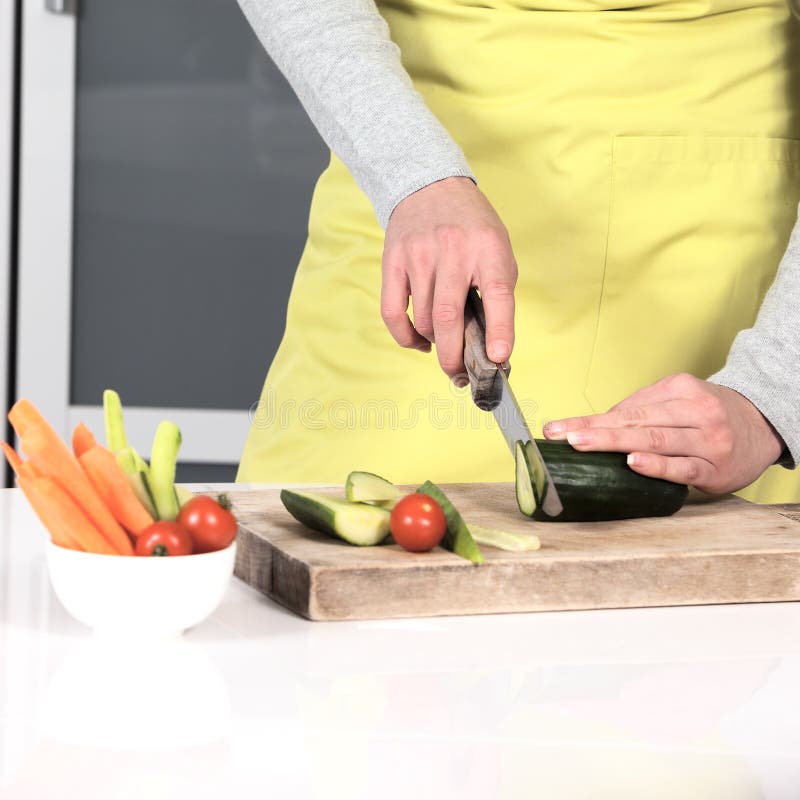 Cutting vegetables at home stock photo. Image of female - 30575614