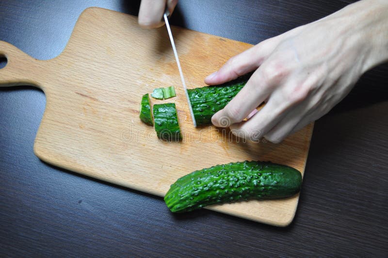 Cutting Vegetables, a Knife in Hands, on a Board Stock Image - Image of ...