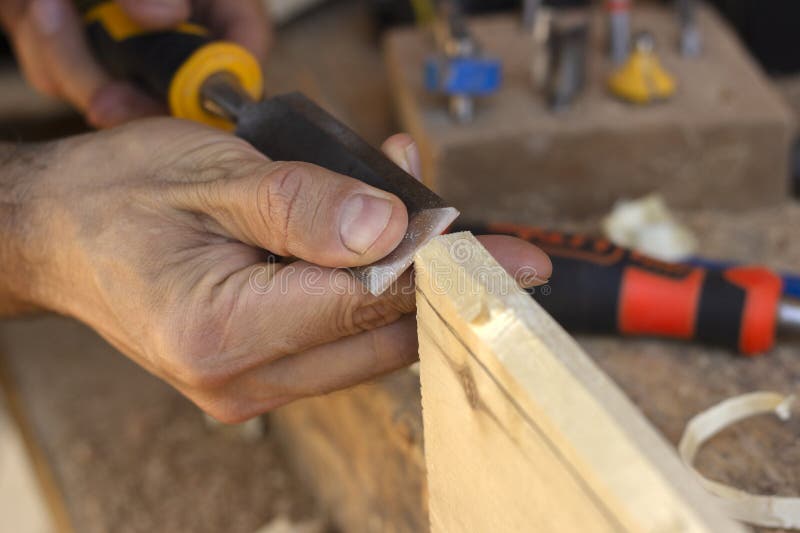 Cutting wood with a chisel stock photo. Image of craft - 328095050
