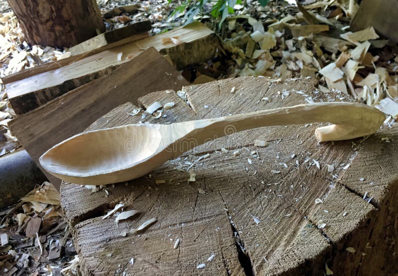 Cutting wood into a spoon stock photo. Image of summer - 132243820