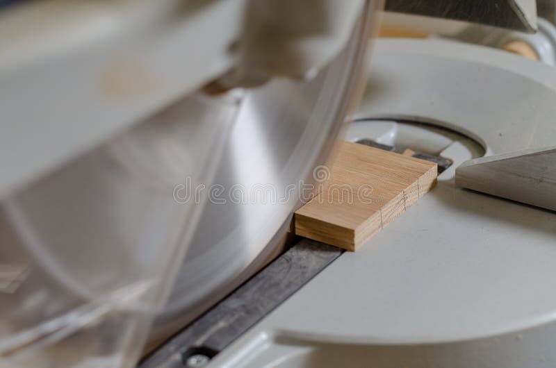 Cutting a Wooden Board on a Carpentry Machine. Woodworking Industry ...