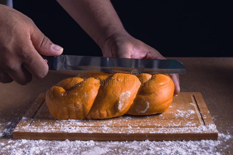 Cutting Yellow Bread on the Table with Knife Stock Image - Image of ...